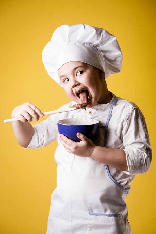Little boy chef in uniform stock photo. Image of occupation - 37701016