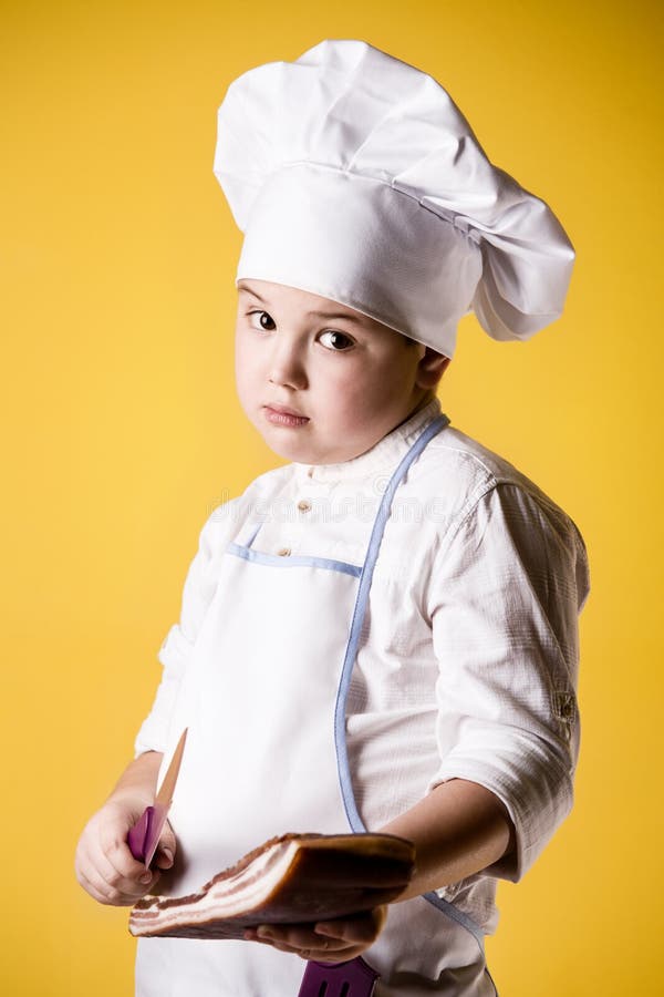 Little boy chef in uniform stock photo. Image of cuisine - 37704276