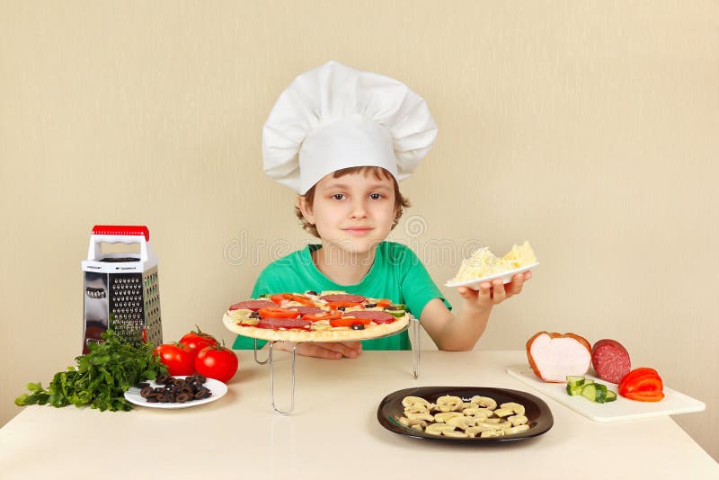 Little Boy in Chefs Hat with Grated Cheese for Pizza Stock Image ...
