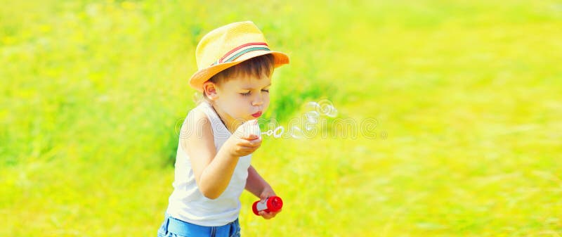 Little Boy Child Blowing Soap Bubbles on Sunny Summer Day Stock Photo ... Little Boy Child Blowing Soap Bubbles on Sunny Summer Day Stock Photo ...