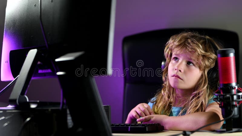 A Little Boy Child Uses a Desktop at Night, a Child with Computer ...
