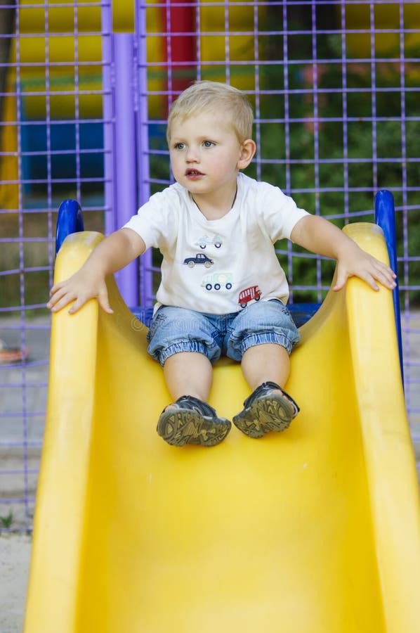Little Boy on a Children S Slide in the Park on a Walk Stock Image ...