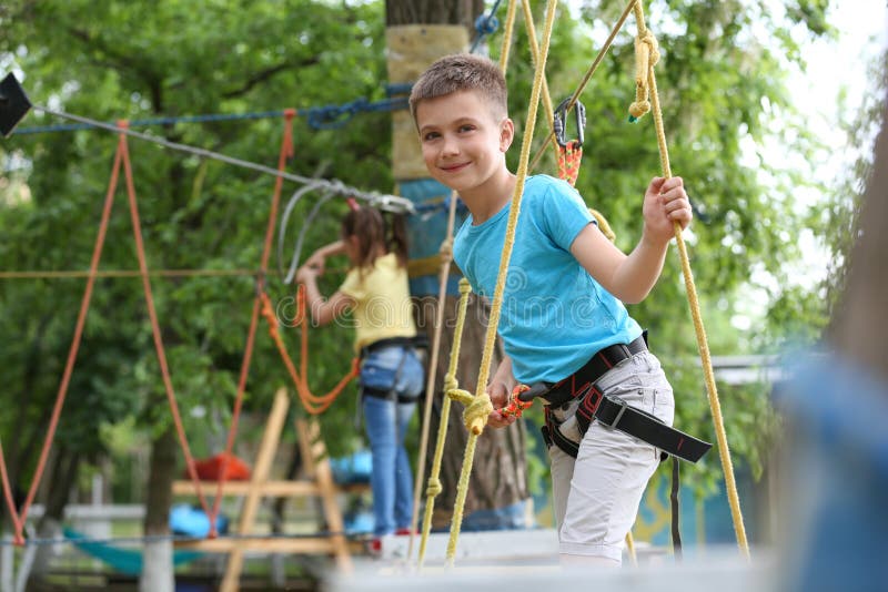 Little Boy Climbing in Adventure Park Stock Photo - Image of challenge ...