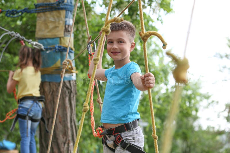Little Boy Climbing in Adventure Park Stock Photo - Image of brave ...