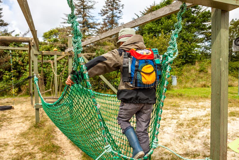 Little Boy Climbing on the Net in Adventure Park Stock Photo - Image of ...