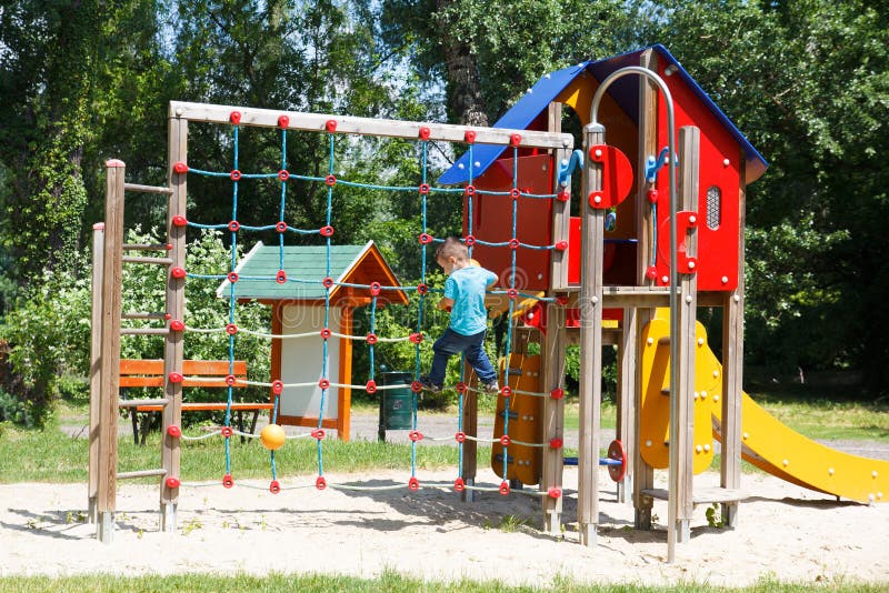 Little Boy Climbing on Jungle Gym without Rope and Helmet Stock Image ...