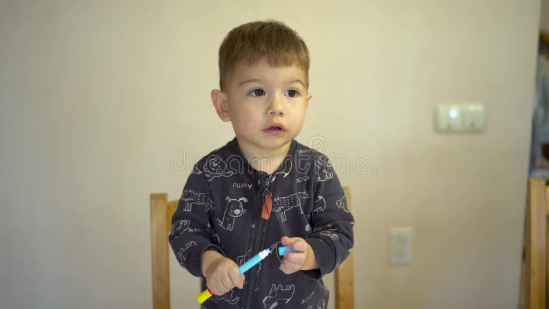 A Little Boy Closes the Cap of a Felt-tip Pen. Child with a Felt-tip ...
