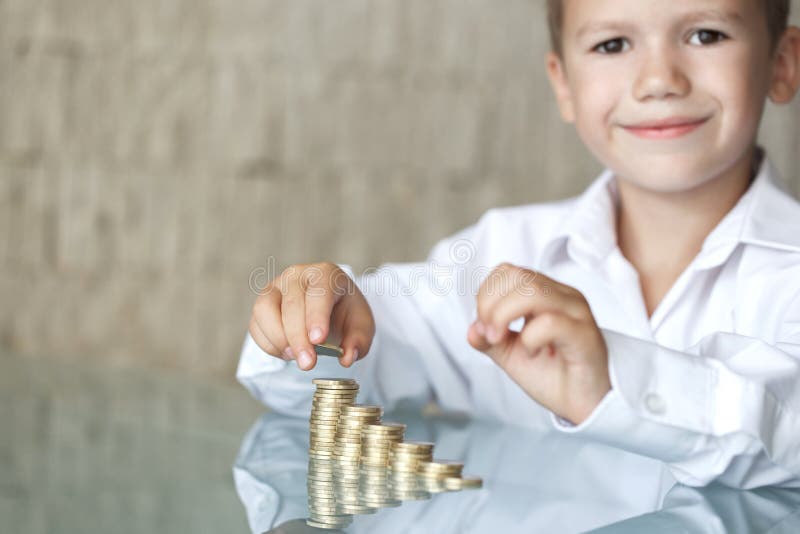 Little Boy with Coin Column Stock Photo - Image of investment, build ...