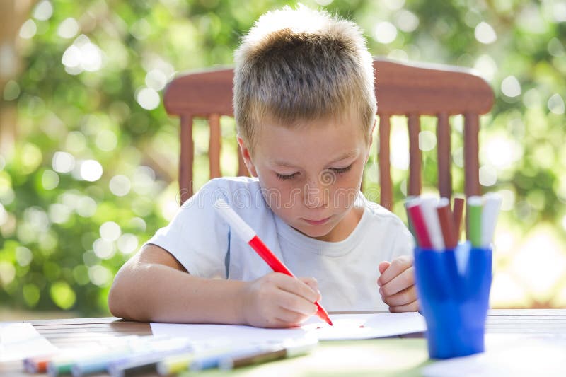 Little Boy Coloring Outside Stock Image - Image of schooler, outdoors ...