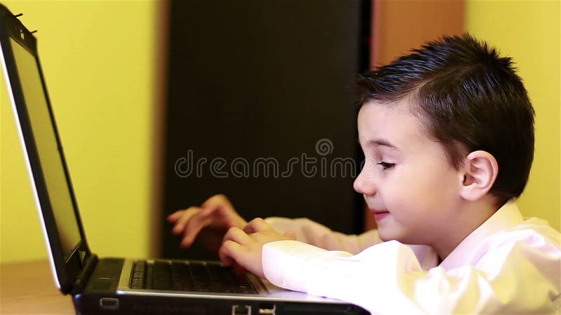Little boy at the computer stock footage. Video of development - 36797265