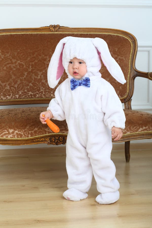 Little Boy in Costume Bunny Holding Stock Photo - Image of male, infant ...