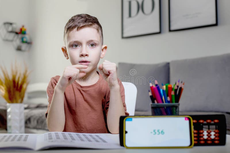 Little Boy Counting with the Help of Mental Arithmetic. Mathematics in ...