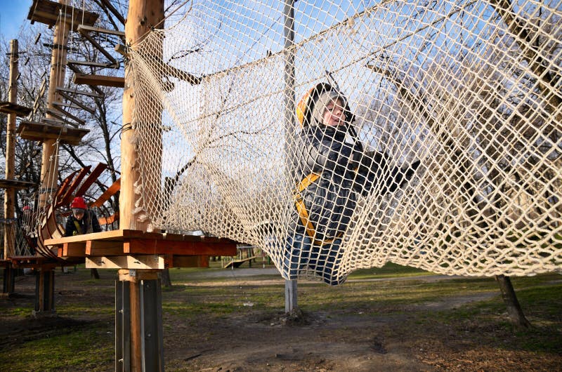 Little Boy Crawling Suspension Net Bridge Horizontal Stock Photos ...