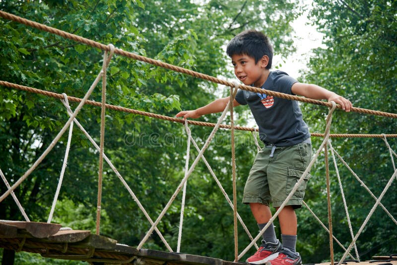 Little Boy Crossing a Wooden Bridge Stock Photo - Image of wood, small ...