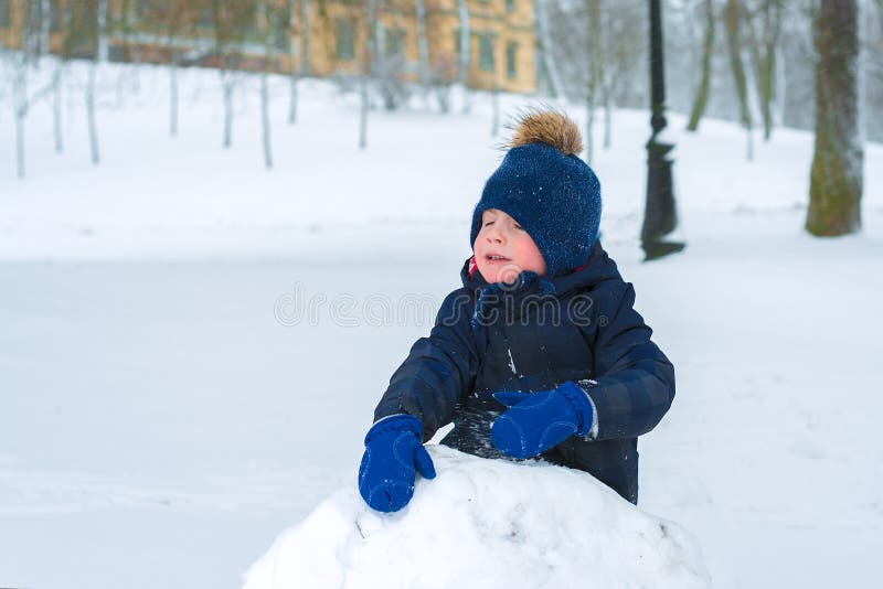 Little Boy is Crying in the Winter in the Cold. the Child is Sad Stock ...