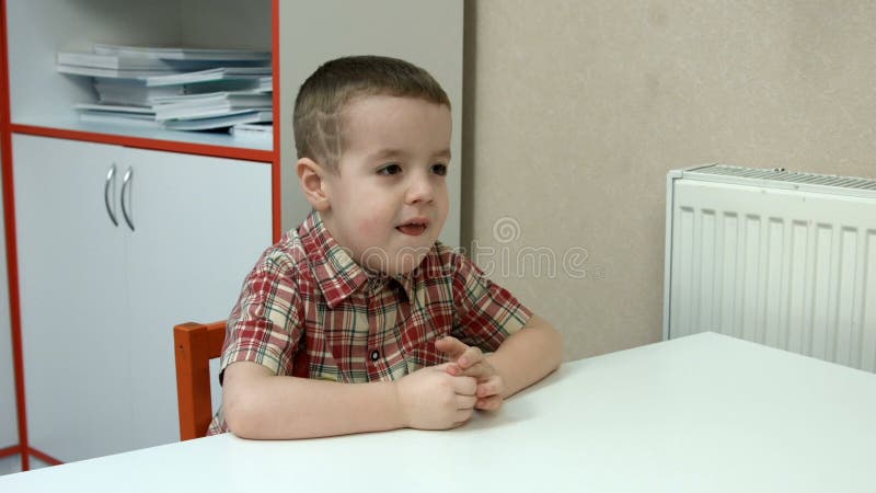 Little boy at the Desk stock video. Video of four, development - 73326863