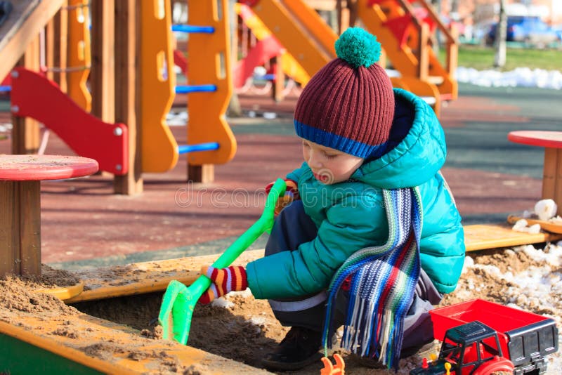 Little Boy Digging in Playground Outdoors Stock Photo - Image of winter ...