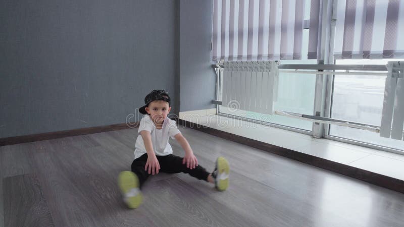 Little Boy Does Exercise To Stretch and Does the Splits after ...
