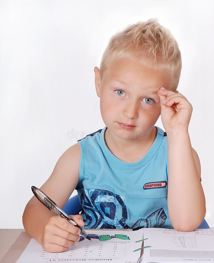 Little boy doing homework stock photo. Image of smiling - 5847902