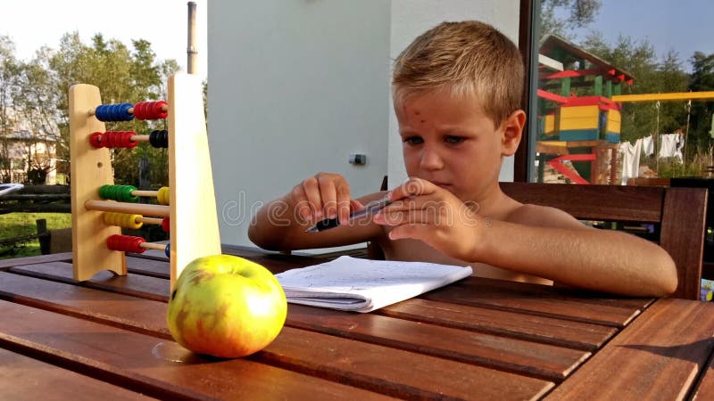 Little Boy Doing Homework Outside Stock Footage - Video of math, house ...