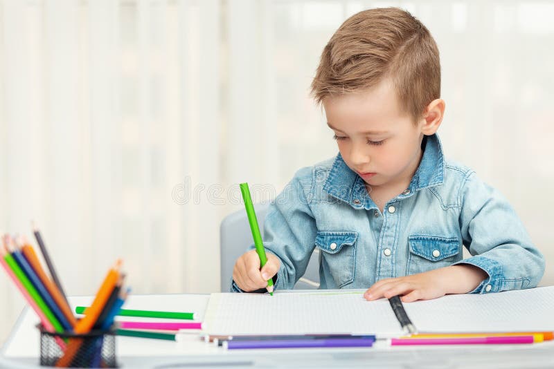 Little Boy Doing Homework Writing and Painting. Preschooler Learn To ...