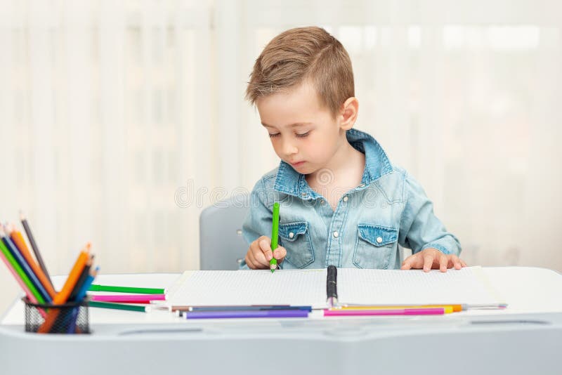 Little Boy Doing Homework Writing and Painting. Preschooler Learn To ...