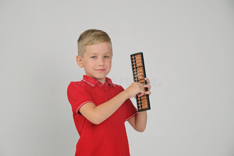 Little Boy Doing Simple Math Exercises with Abacus Scores. Math and ...