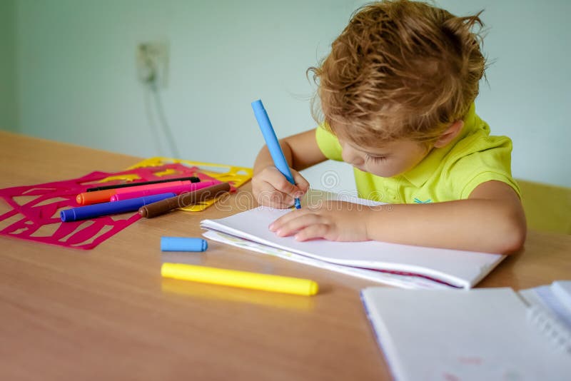 Little Boy Drawing with Color Crayons Stock Image - Image of colorful ...