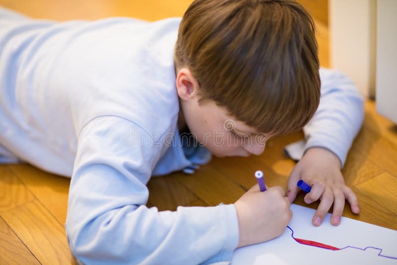 Little boy drawing at home stock image. Image of active - 245580795