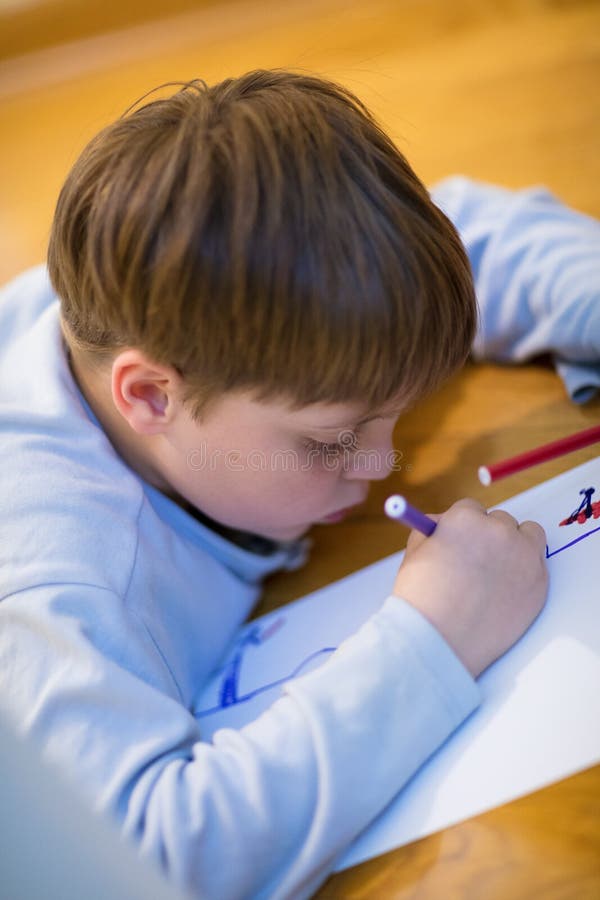 Little boy drawing at home stock photo. Image of draw - 245580860