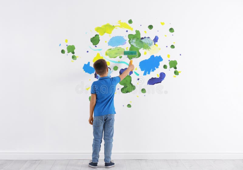 Little Boy Drawing on White Wall, Back View Stock Photo - Image of ...