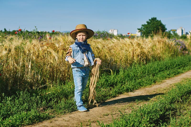 Little Boy Dressed in Western Style in the Field Stock Photo - Image of ...