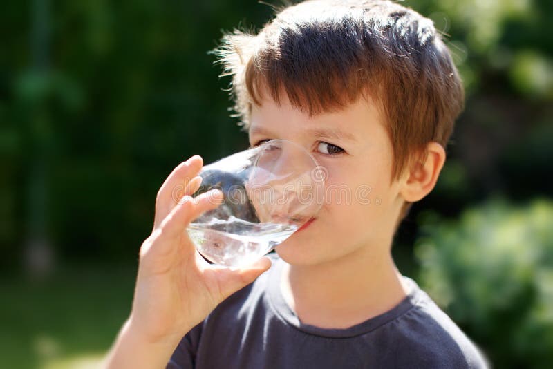Little Boy Drink Water In Nature Stock Photo - Image: 55181762