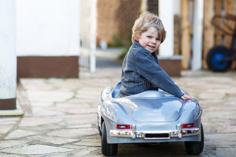 Little Boy Driving Big Toy Car, Outdoors Stock Image - Image of cute ...
