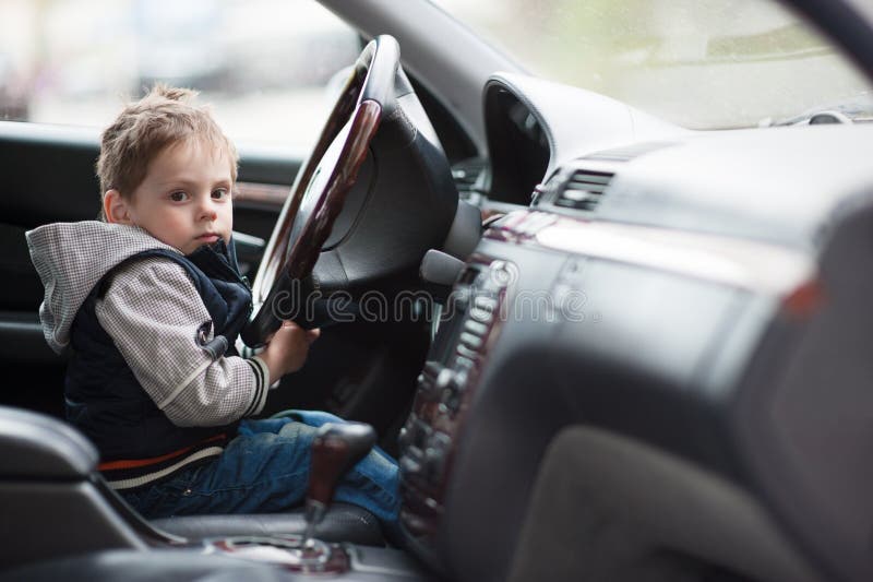 Little boy driving a car stock photo. Image of caucasian - 74084374