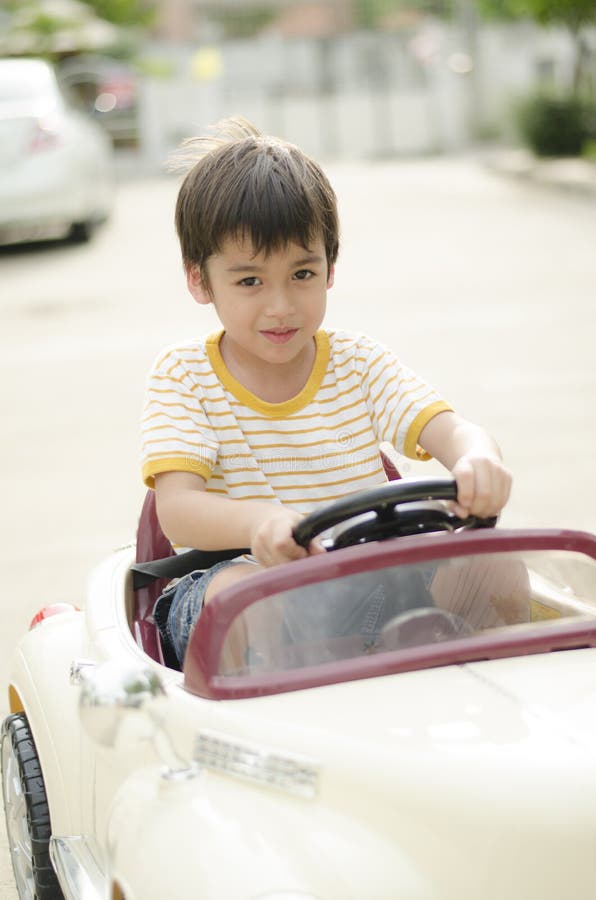 Little Boy Driving a Little Car Stock Image - Image of love, playground ...