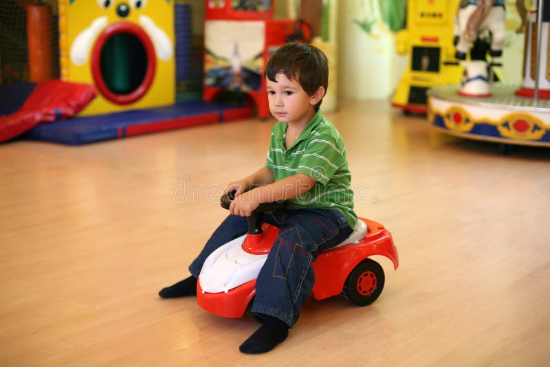 Little Boy Driving a Toy Car Stock Image - Image of male, beautiful ...