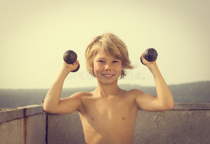 Little Boy with Dumbbells Doing Exercises Stock Photo - Image of blond ...