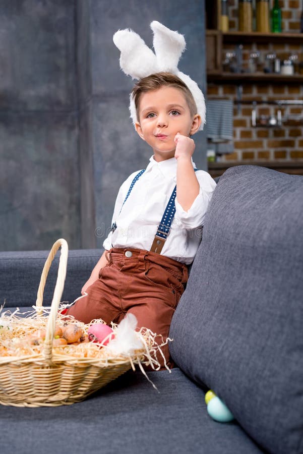 Little Boy with Easter Eggs Stock Image - Image of seasonal, pensive ...