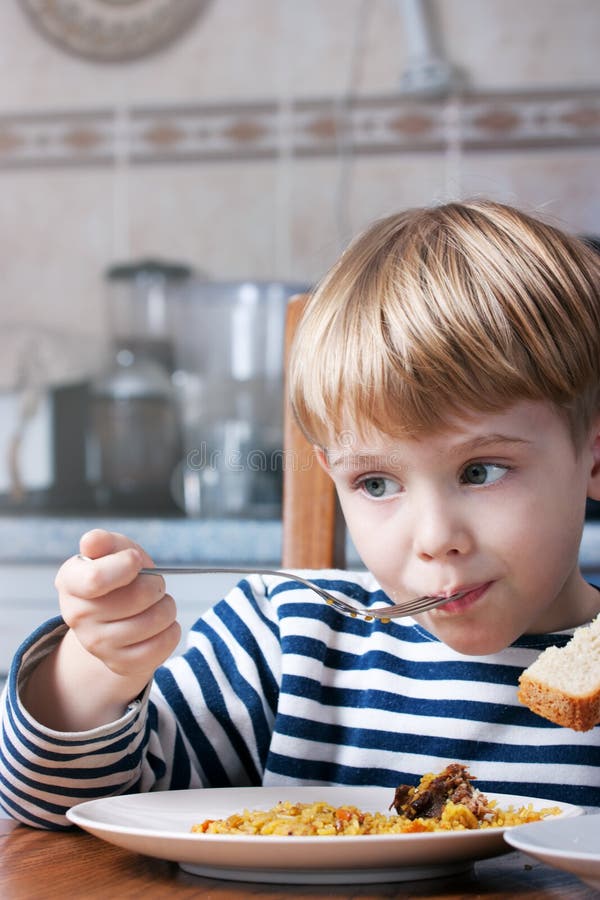 Little boy eating stock photo. Image of human, little - 12167212