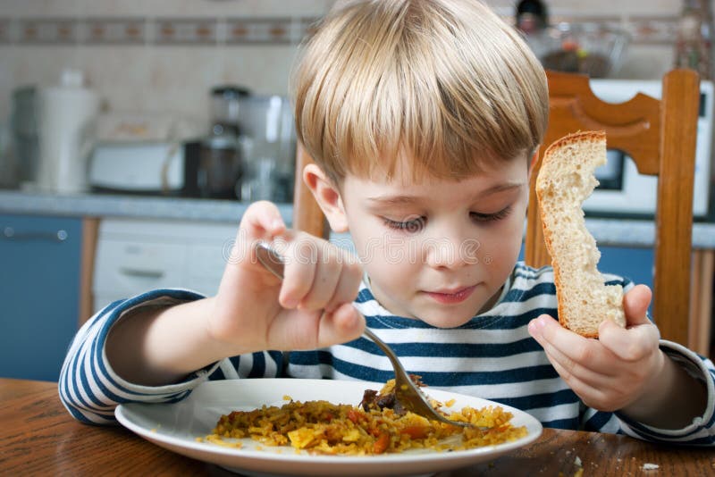 Little boy eating stock image. Image of lunch, cute, bread - 12259383