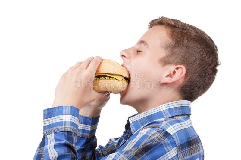 Boy eating a burger stock photo. Image of closeup, dinner - 57579932