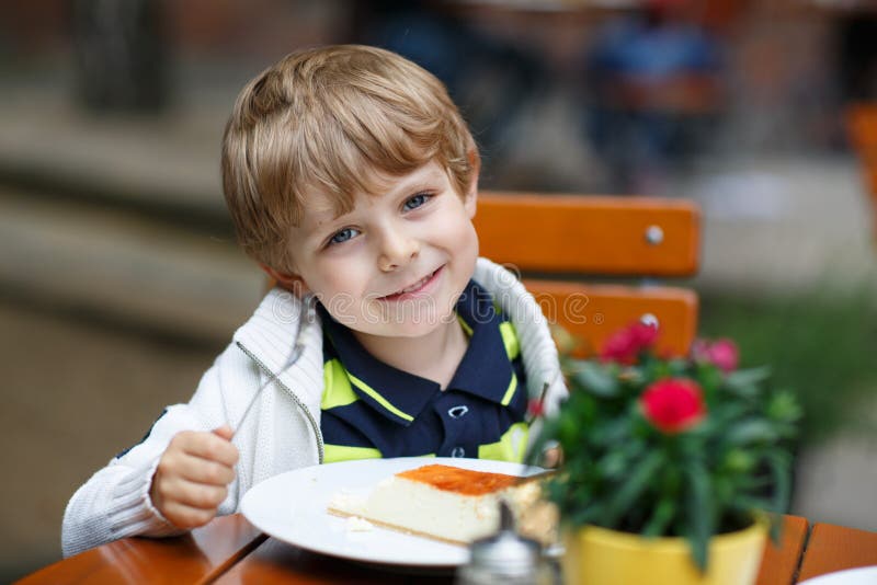 Little Boy Eating Cake in Outdoor Cafe. Stock Image - Image of ...