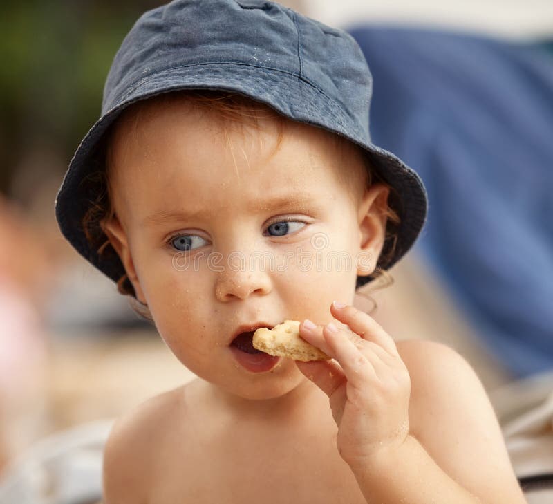 Little boy eating a cookie stock image. Image of cute - 33421371