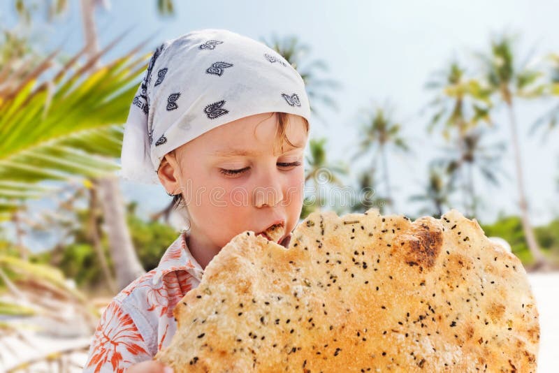 Little boy eating a cookie stock photo. Image of meal - 63185422