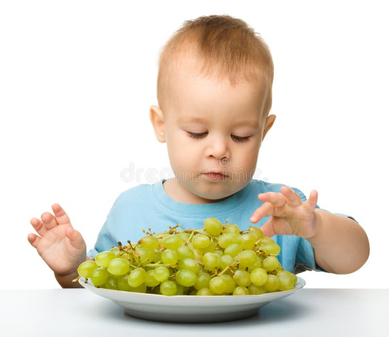 Little Boy is Eating Grapes Stock Image - Image of delicious, diet ...