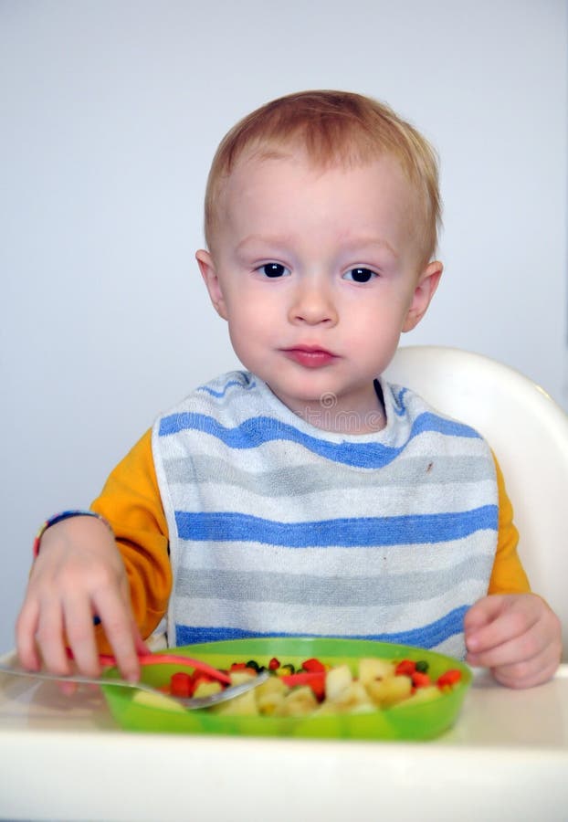 The Little Boy is Eating His Food Stock Image - Image of lunch, plate ...