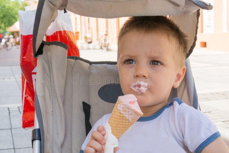 Little Boy Eating Ice Cream Stock Photo - Image of childhood, cold ...