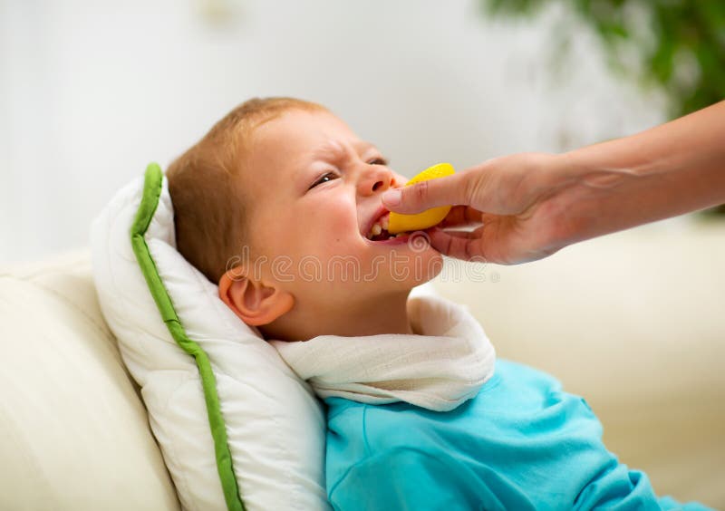 Little Boy Eating a Lemon at Home Stock Image - Image of medical ...