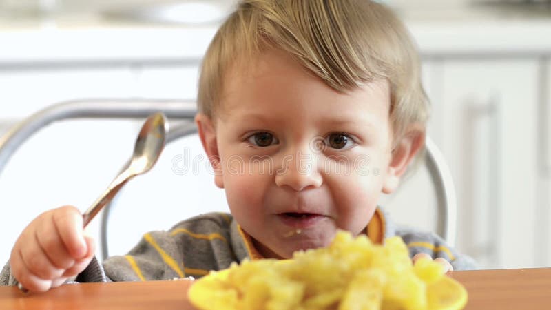 Little Boy Eating Potatoes stock footage. Video of food - 82059232